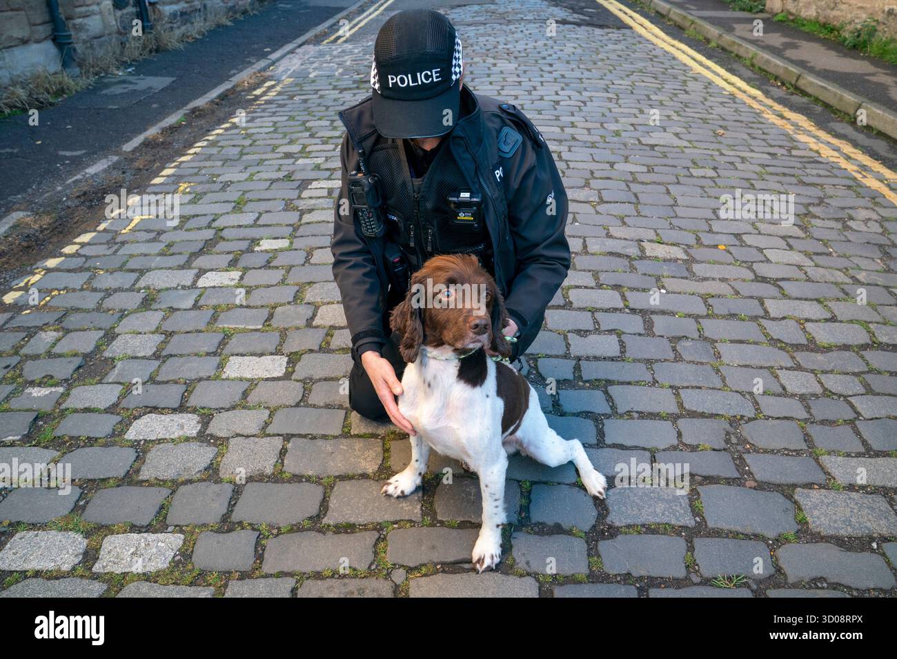A Police Scotland dog handler wears a new body-worn video (BWV) camera ...