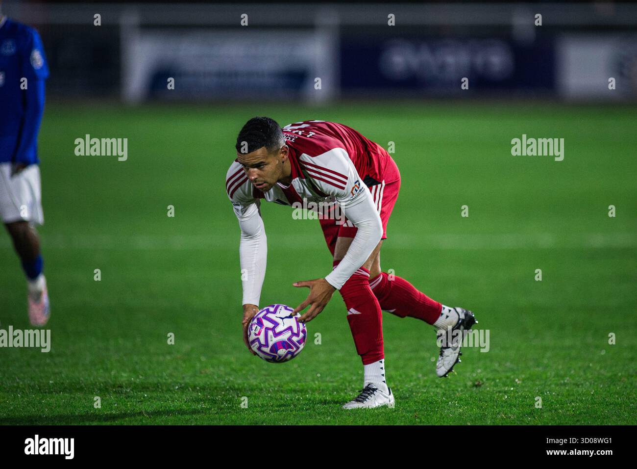 Brackley, UK. 21st Oct, 2025. Tyler Lyttle (2 Brackley Town) picks the ...