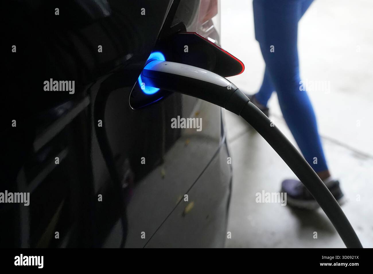 FILE - A Tesla car charges at a home in San Francisco, Aug. 25, 2022 ...