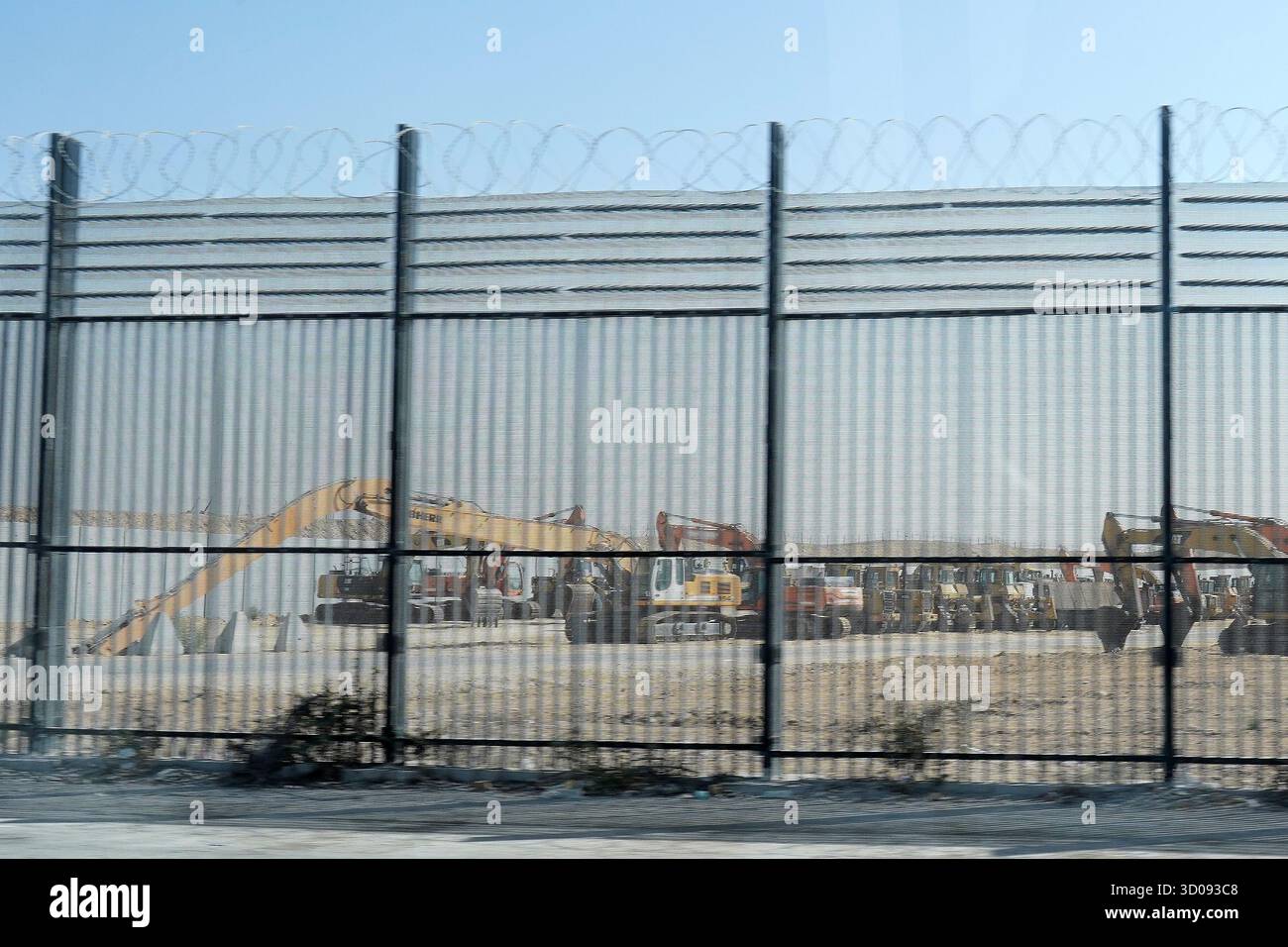 Bulldozers wait to cross the Egyptian gate of the Rafah crossing to ...