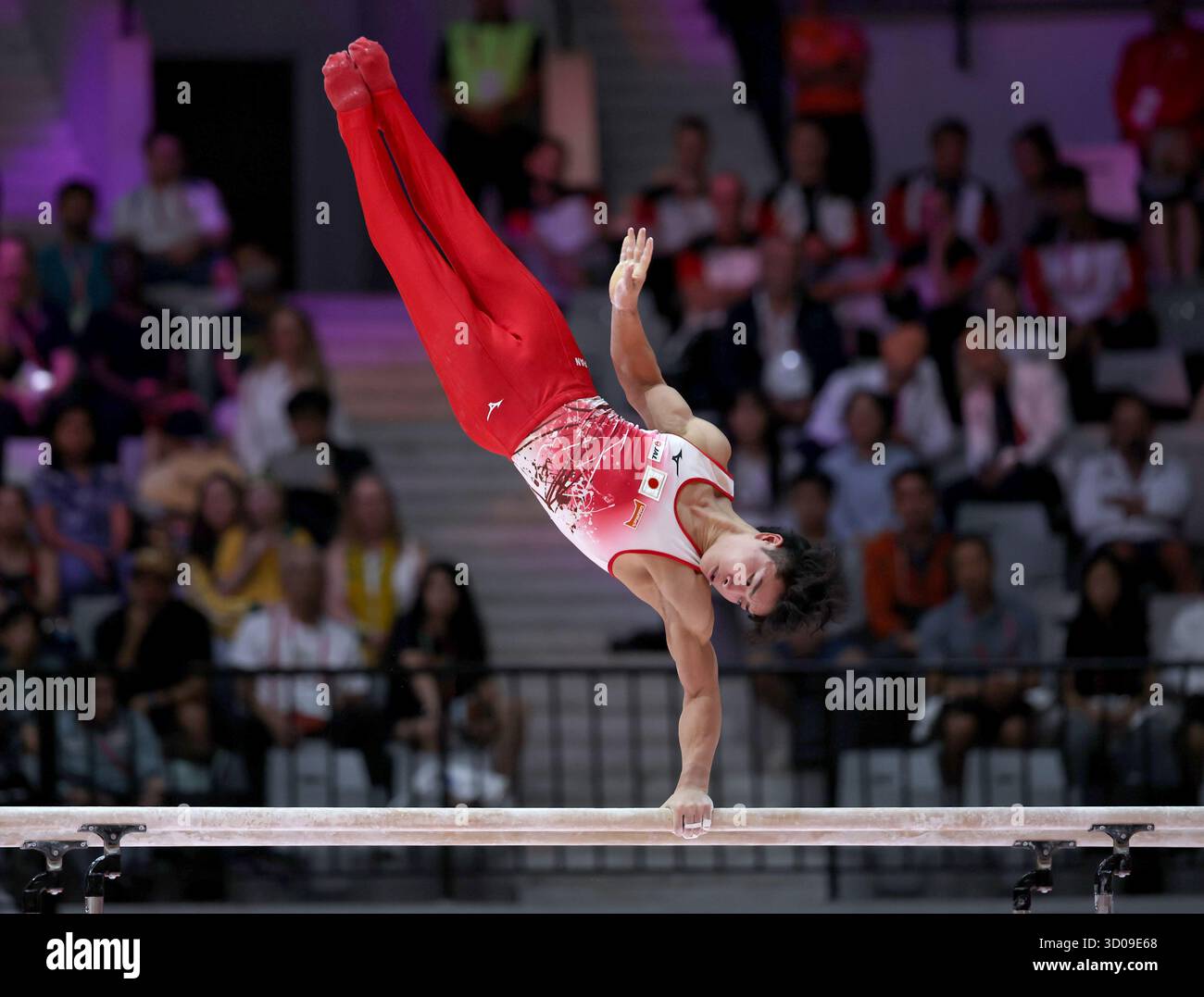 Shinnosuke Oka of Japan performs during parallel bars in men's ...