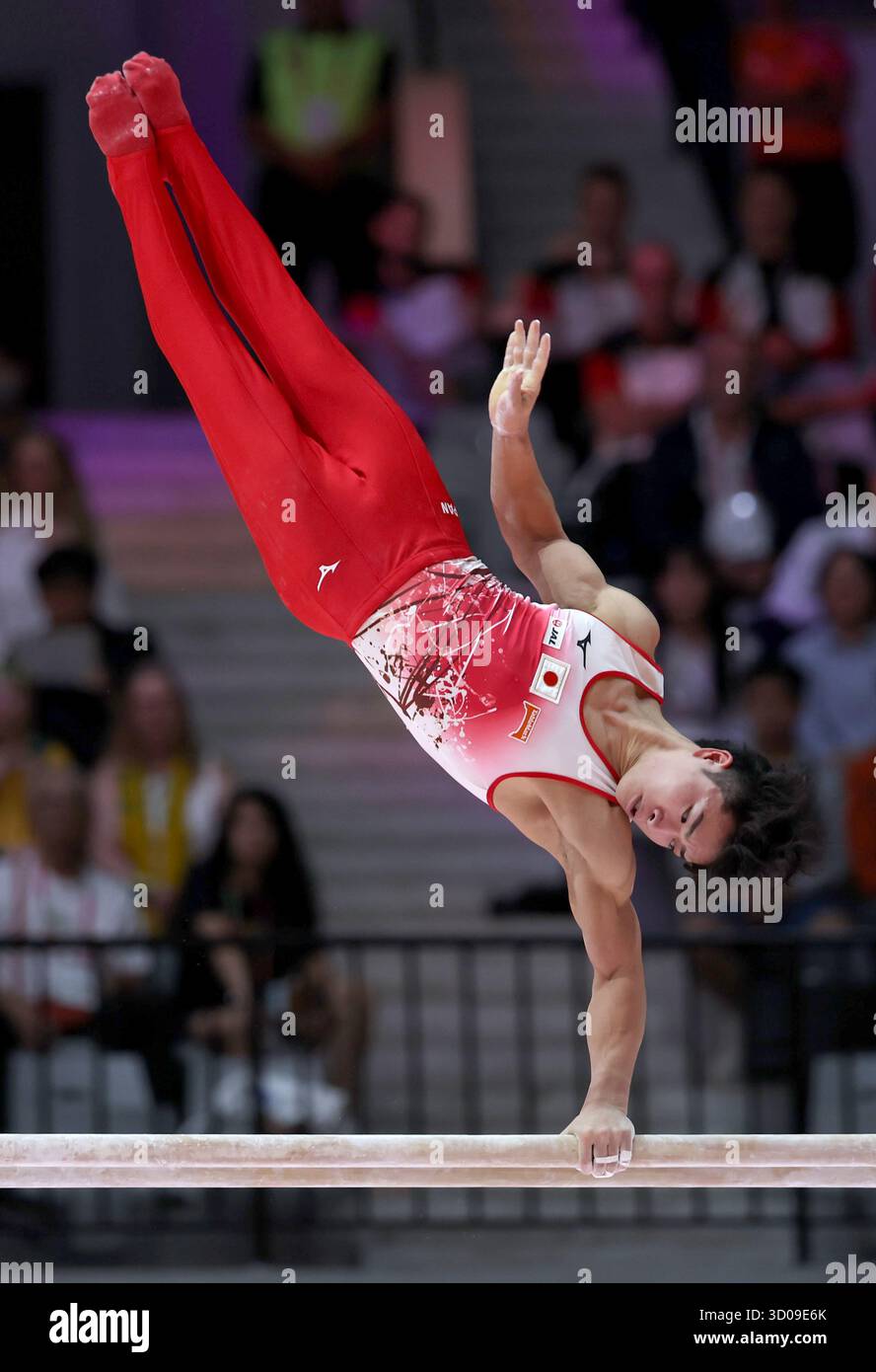 Shinnosuke Oka of Japan performs during parallel bars in men's ...