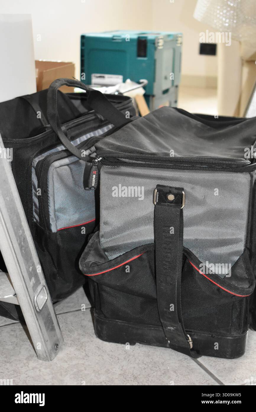 Old metal aluminum tall ladder, bags with tools and toolbox in house or ...
