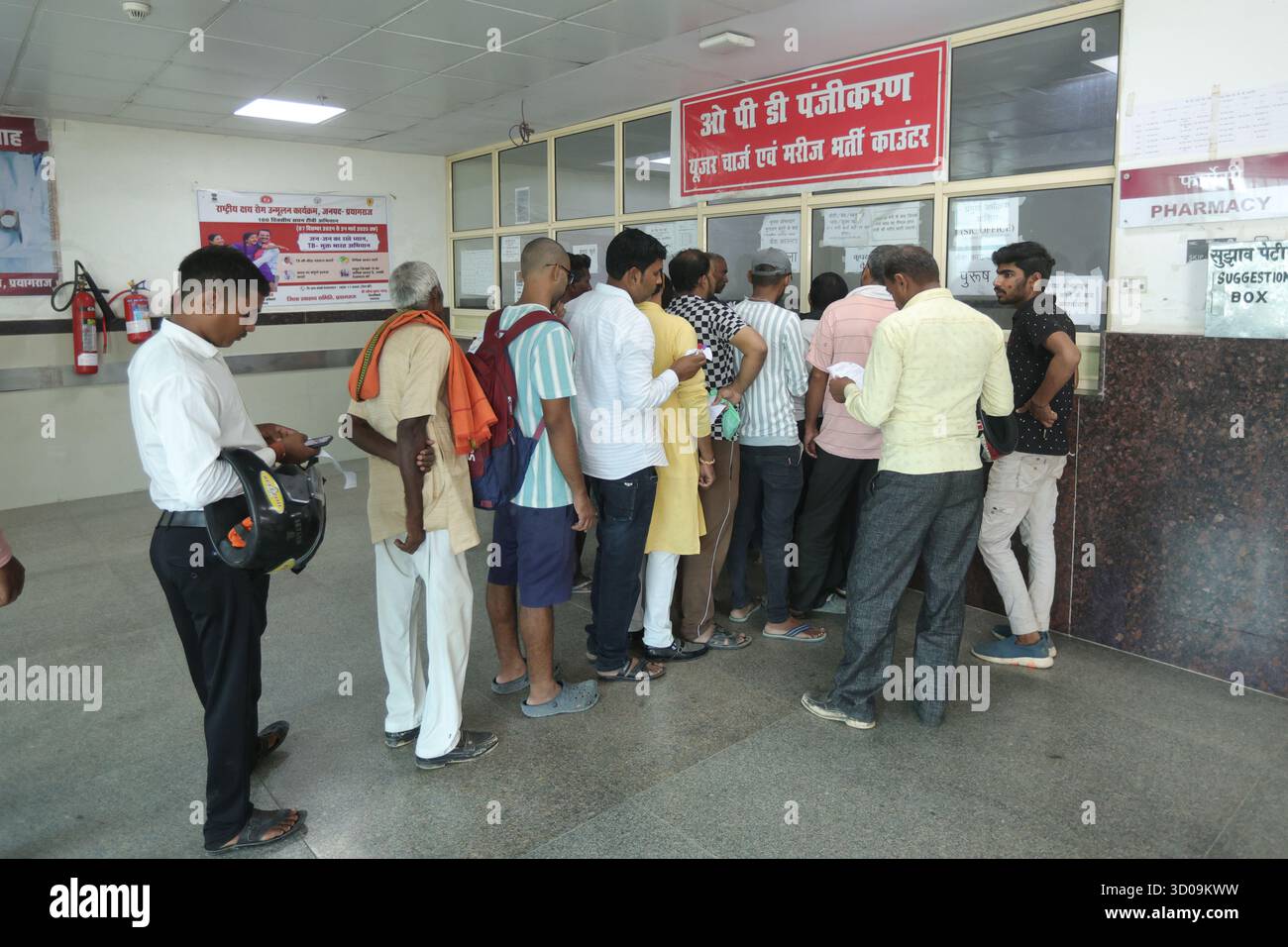 People stands at a OPD (Outer Patient Department) registration counter ...