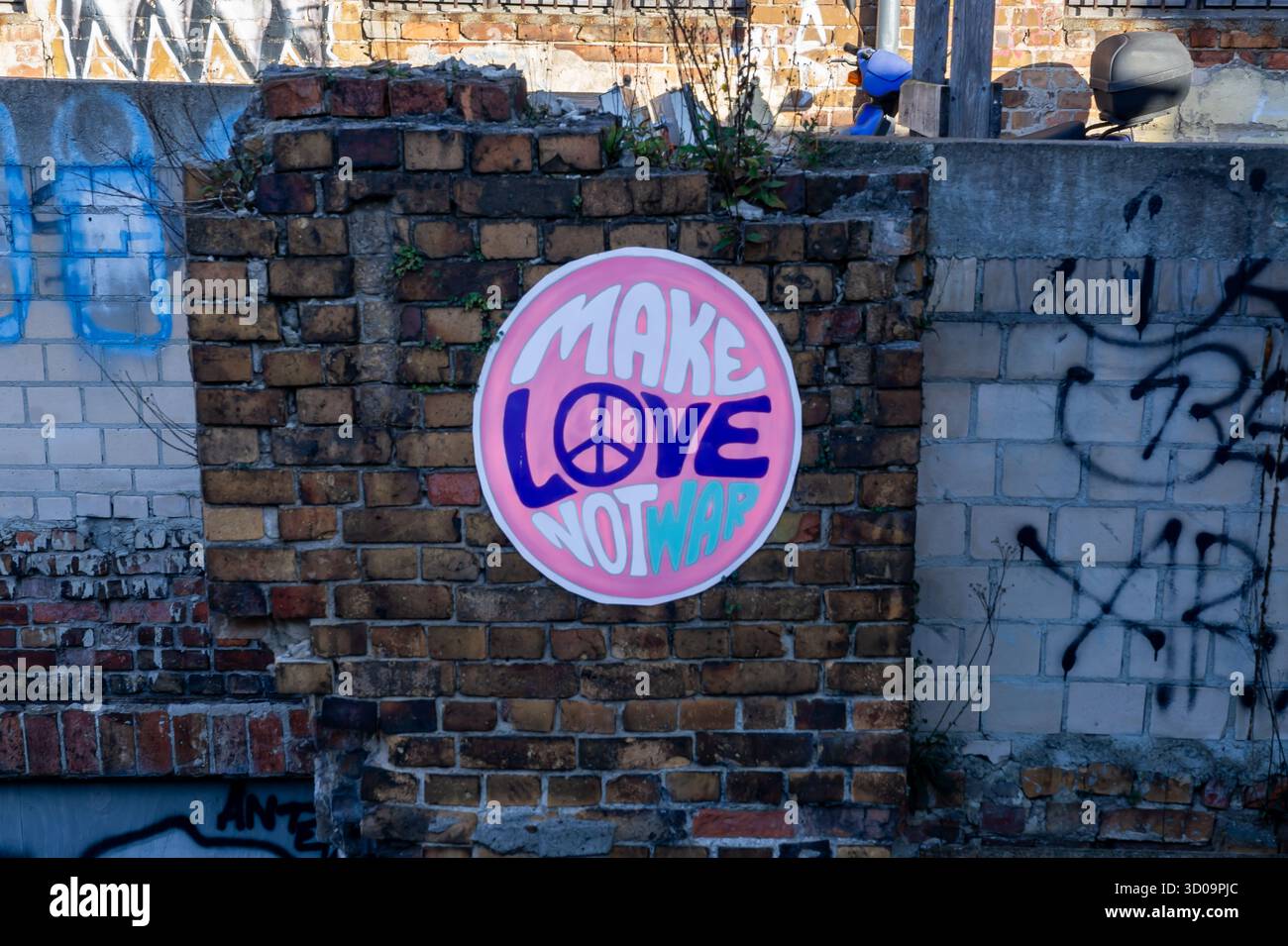 A large round peace sticker with the slogan “Make Love Not War” on a ...