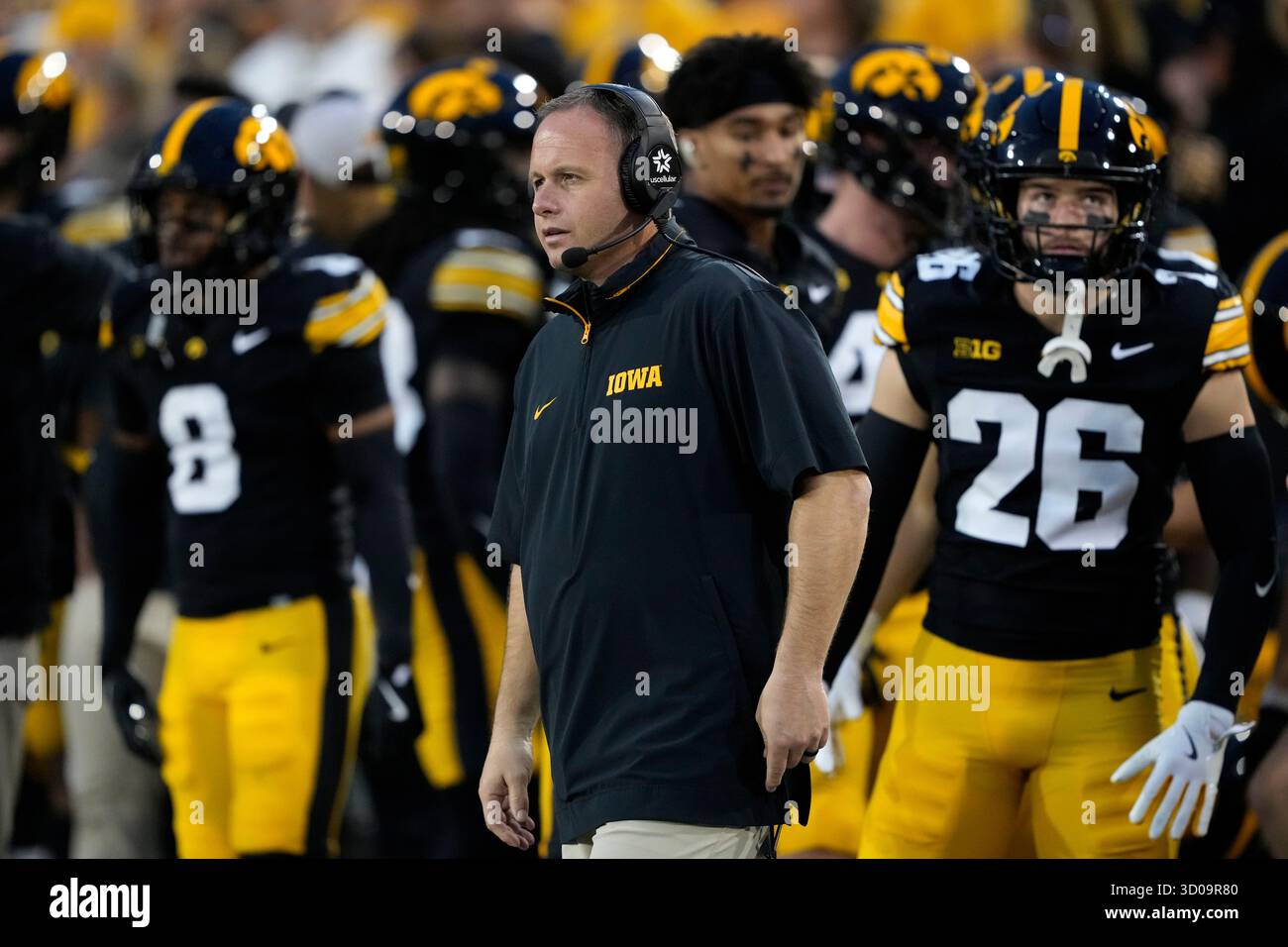 Iowa assistant head coach Seth Wallace stands on the sideline before an ...