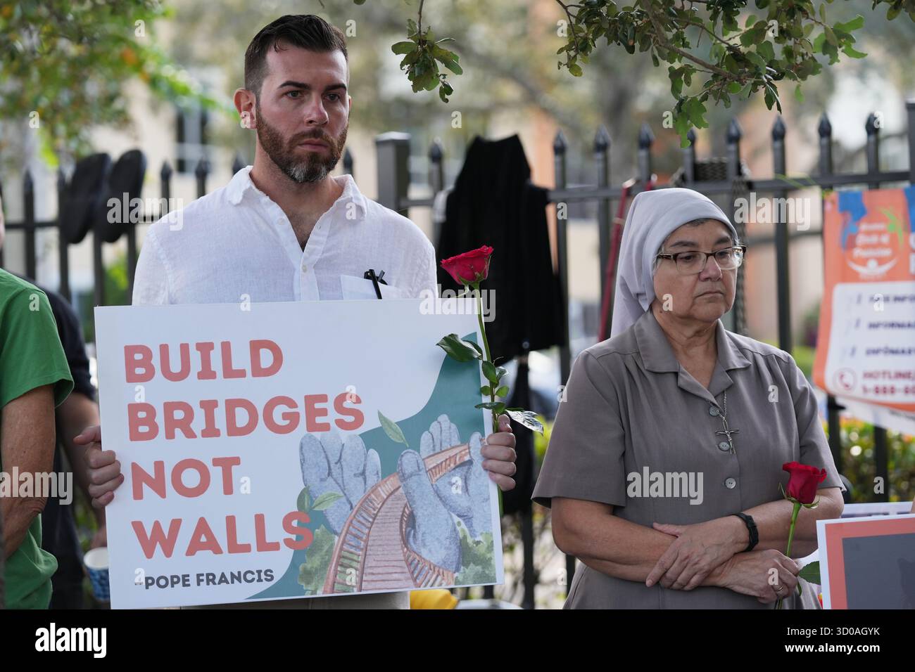 Oliver Larkin, left, and Ondina Cortes, right, attend a prayer service ...