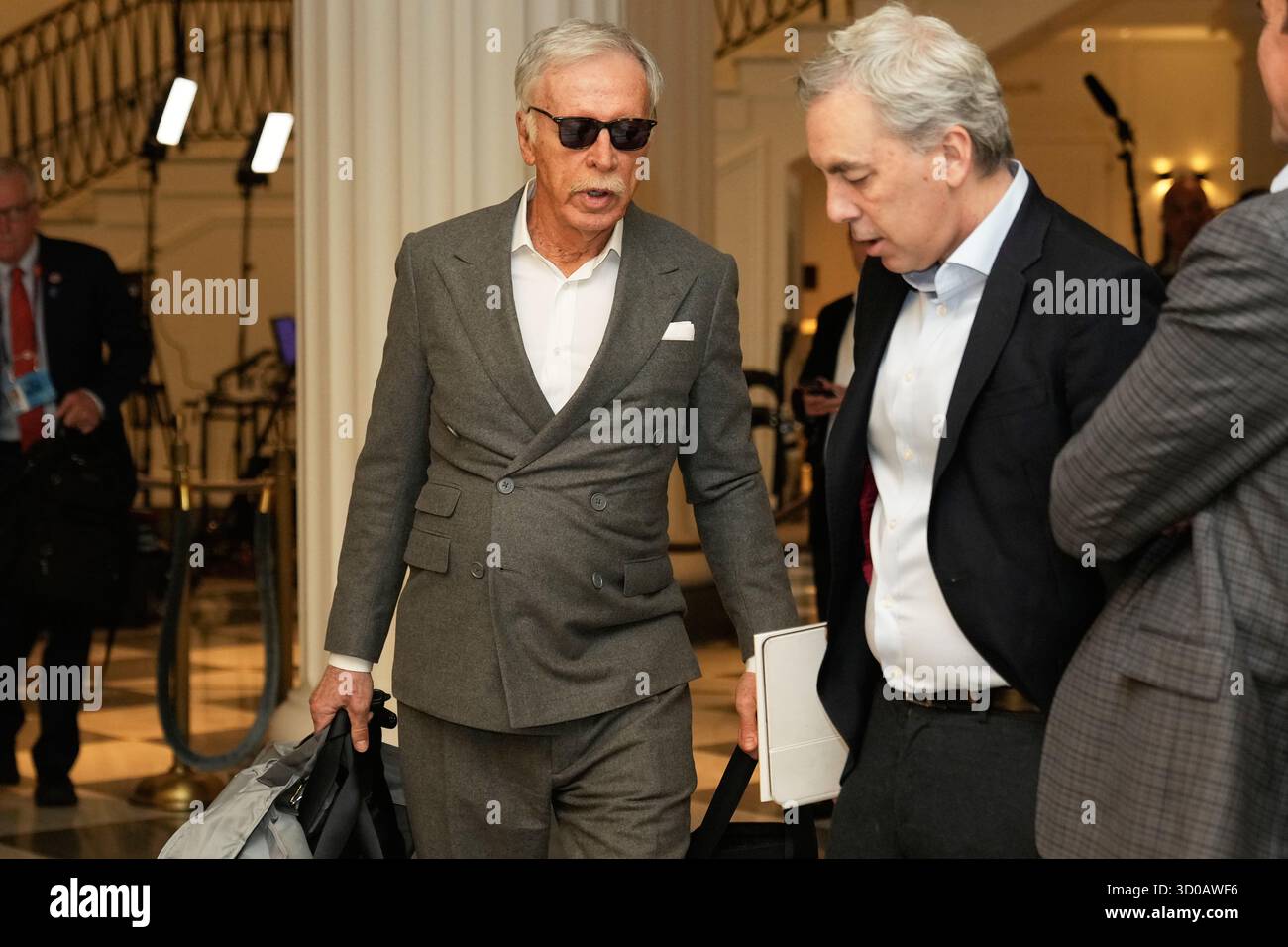 Los Angeles Rams owner Stan Kroenke, left, leaves the NFL owners ...