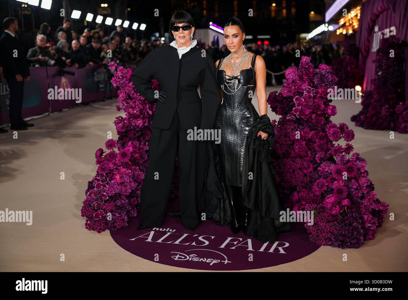 Kris Jenner, left, and Kim Kardashian pose for photographers upon ...