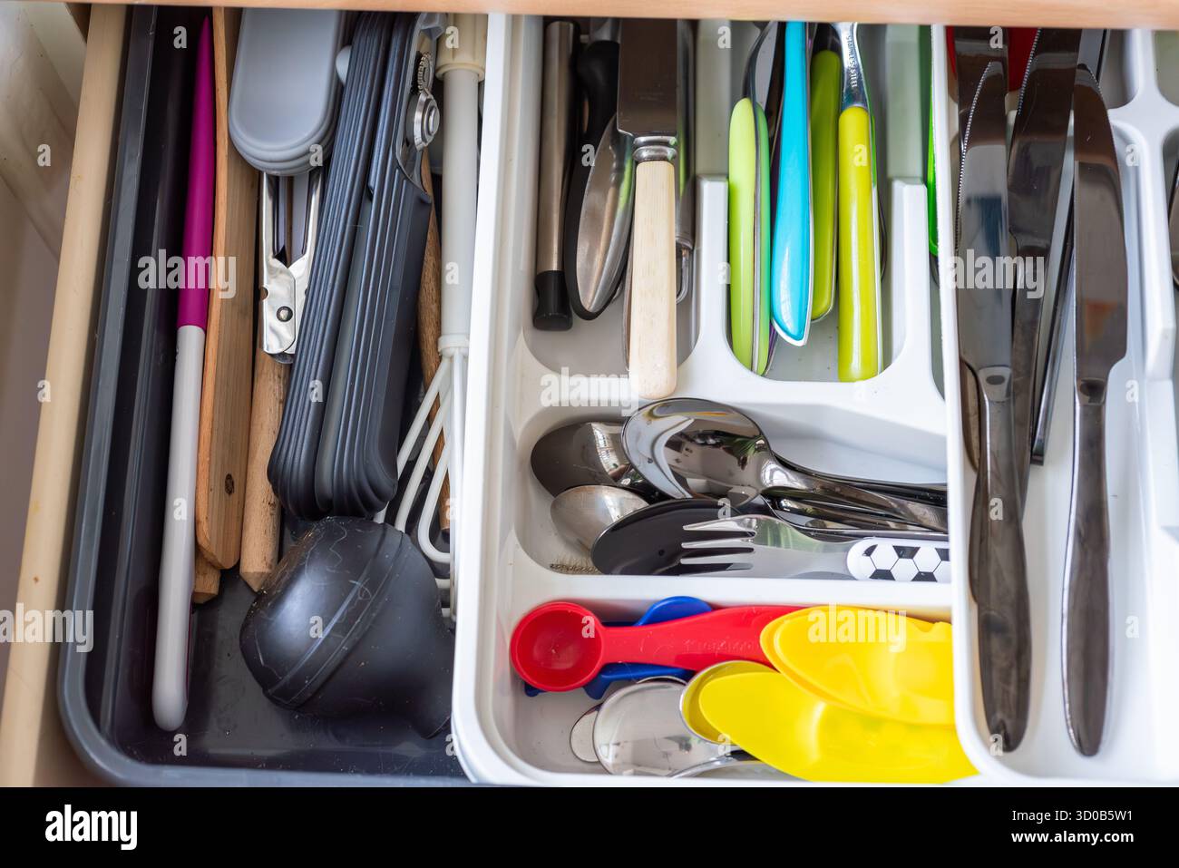Authentic kitchen cutlery drawer with organiser. Knives, forks, spoons ...