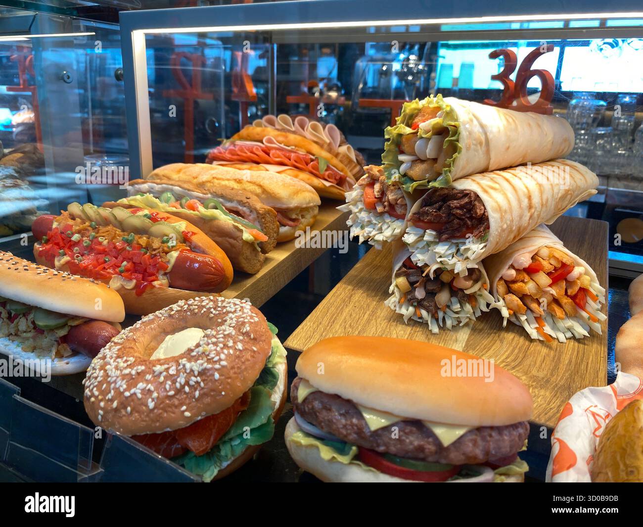 A colorful selection of sandwiches and wraps showcases different ...