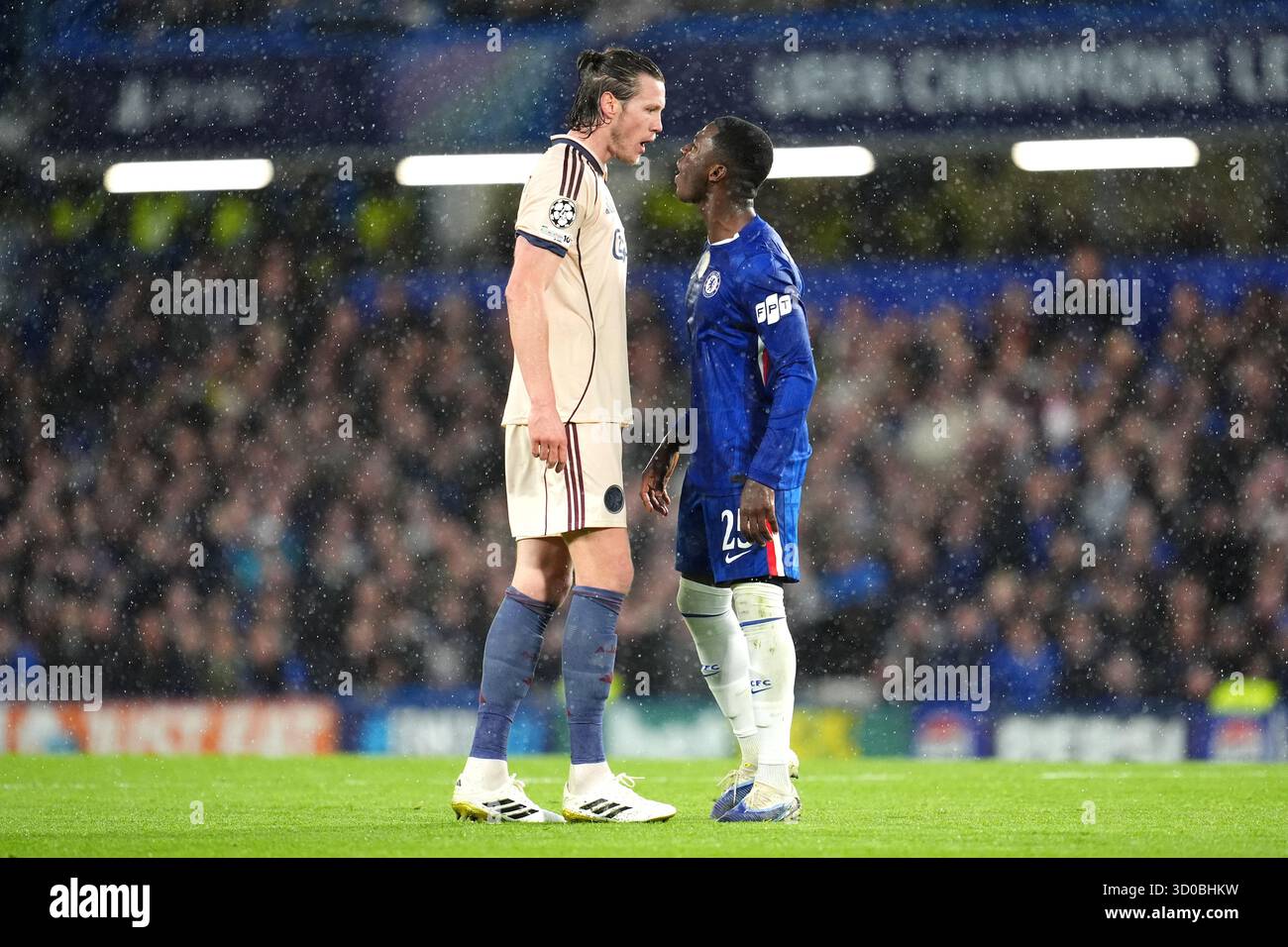 Ajax's Wout Weghorst (left) and Chelsea's Moises Caicedo clash during ...