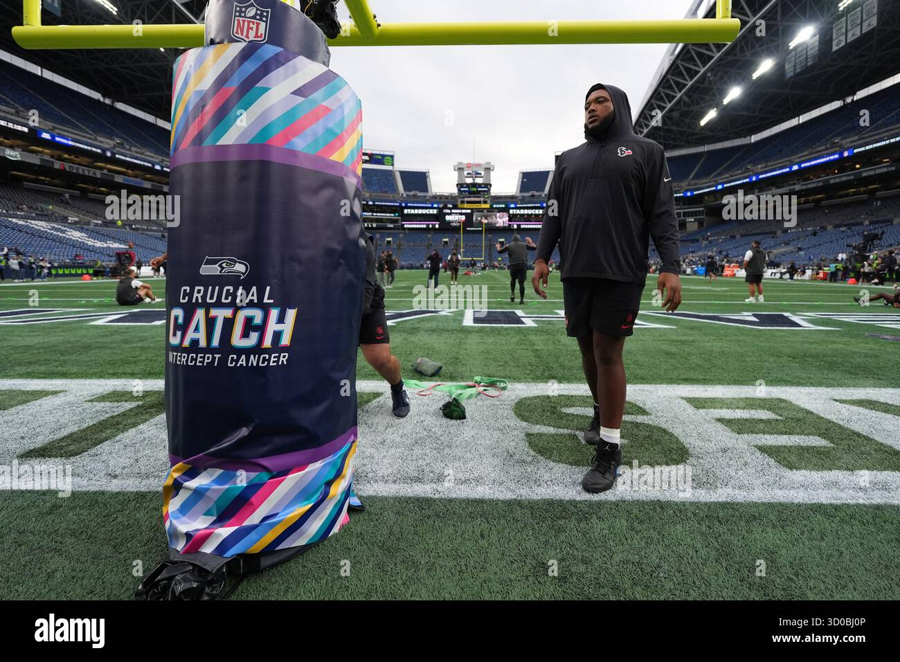 A Crucial Catch banner is seen on a goalpost as a Houston Texans player ...