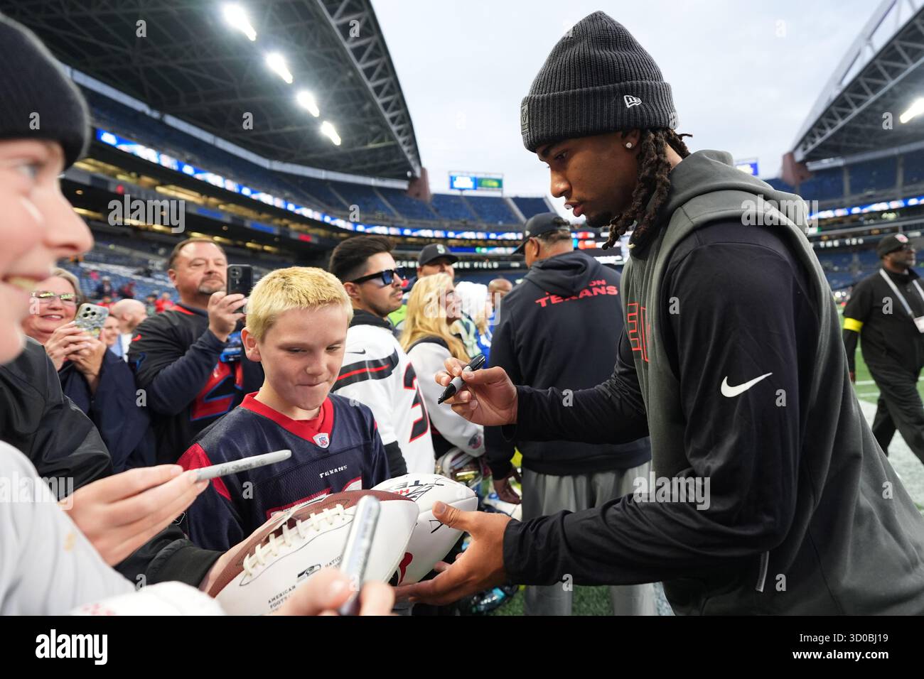 Houston Texans quarterback C.J. Stroud signs autographs for fans before ...