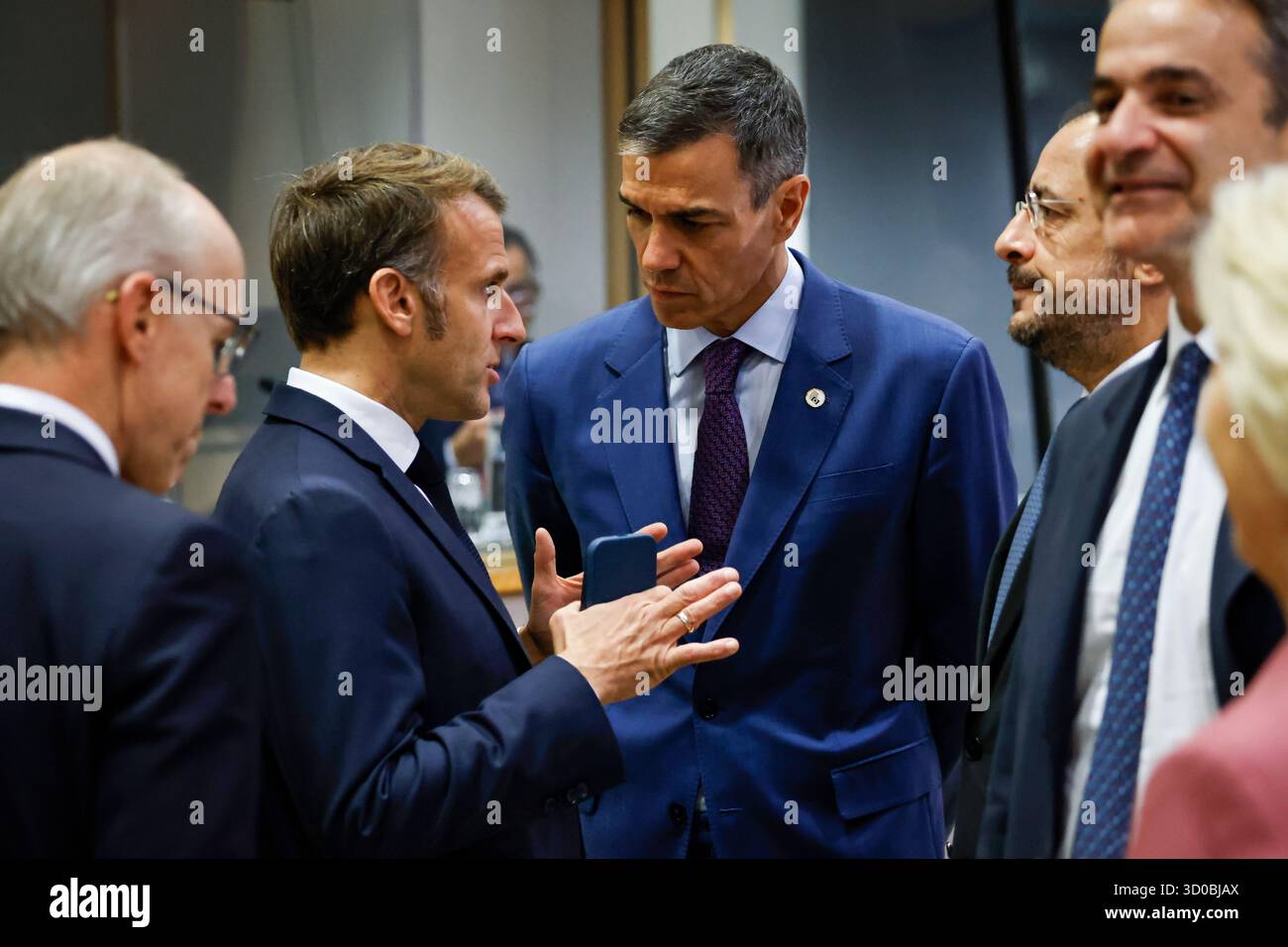 French President Emmanuel Macron, center left, speaks with Spain's ...