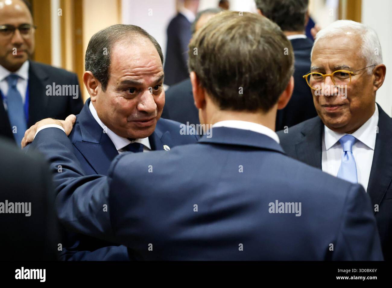 French President Emmanuel Macron, center, speaks with Egypt's President ...