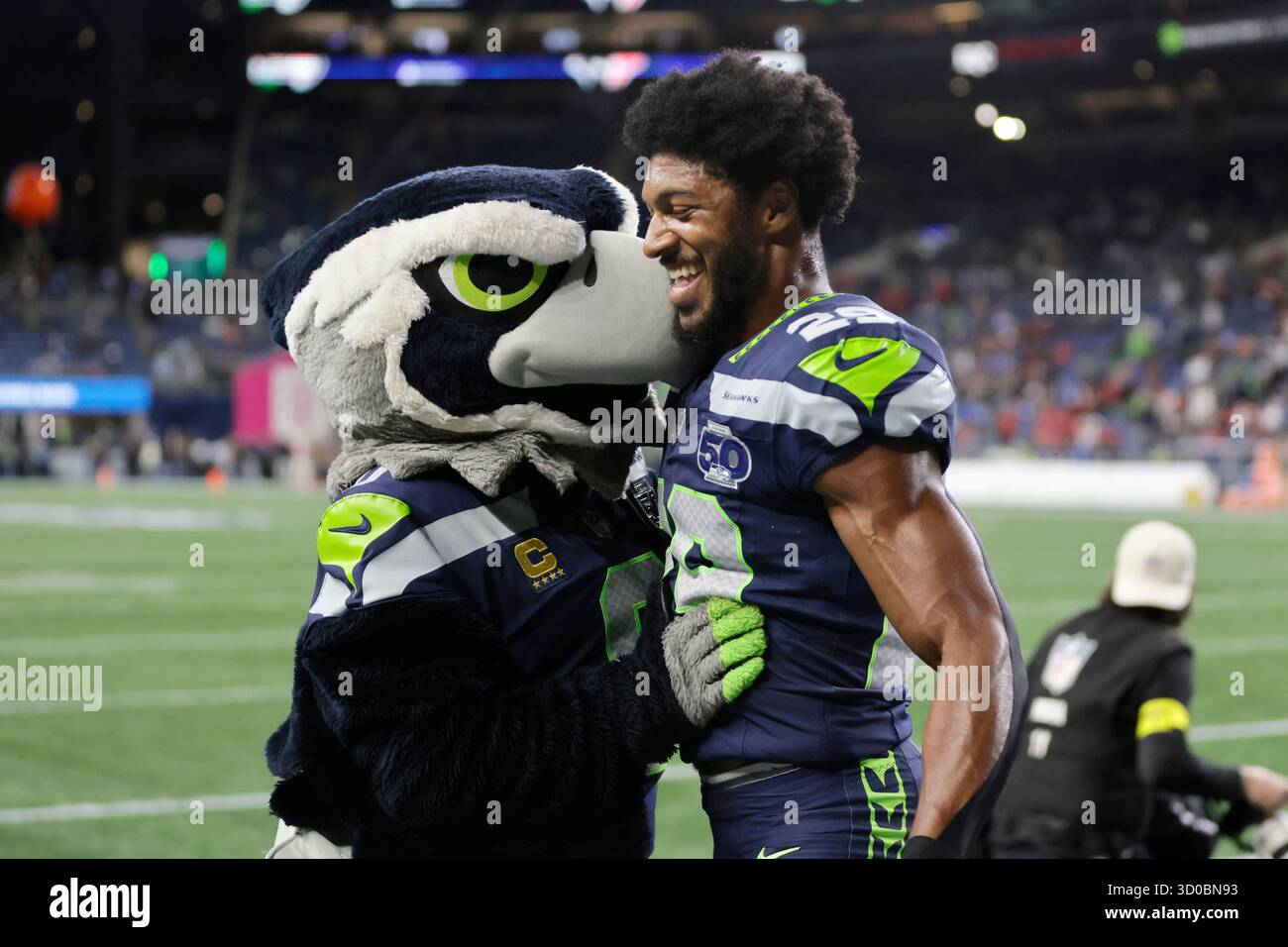 Seattle Seahawks cornerback Josh Jobe (29) hugs the Seahawlks' mascot ...
