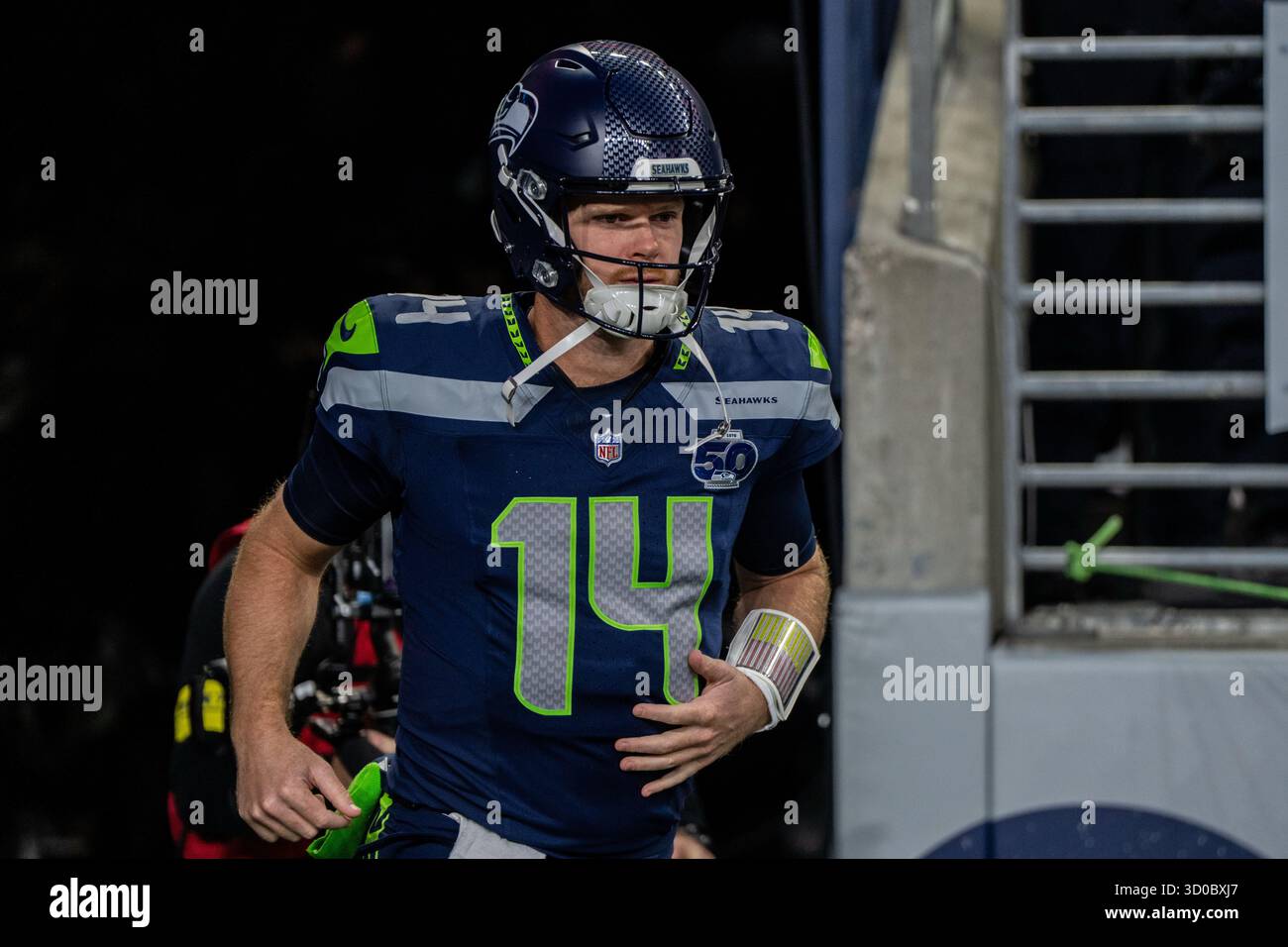 Seattle Seahawks quarterback Sam Darnold jogs on to the field before an ...