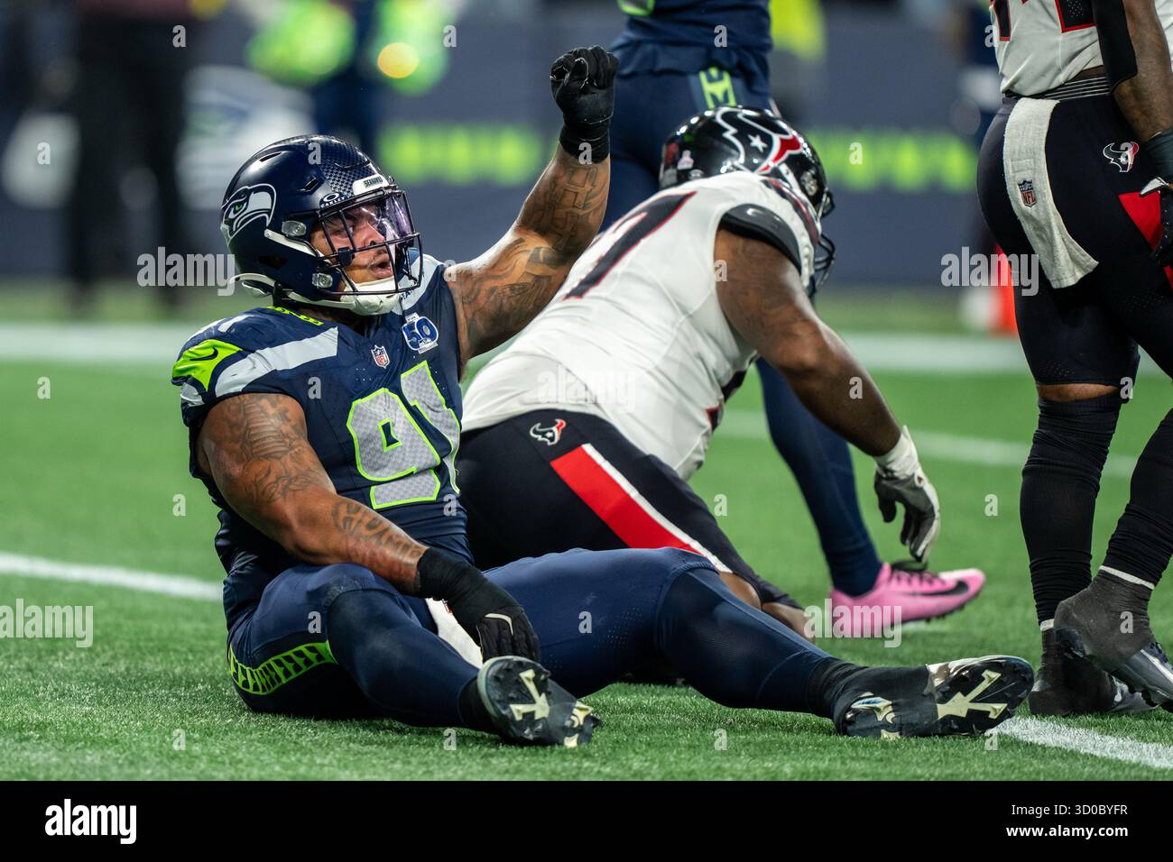 Seattle Seahawks defensive lineman Byron Murphy II gestures during an ...