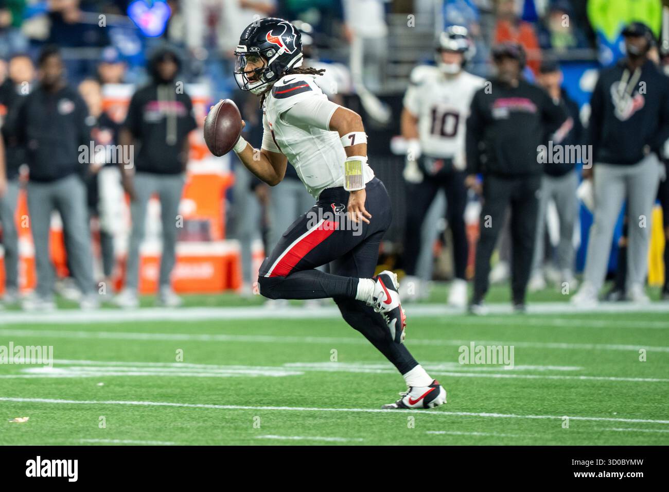 Houston Texans quarterback C.J. Stroud runs with the ball during an NFL ...