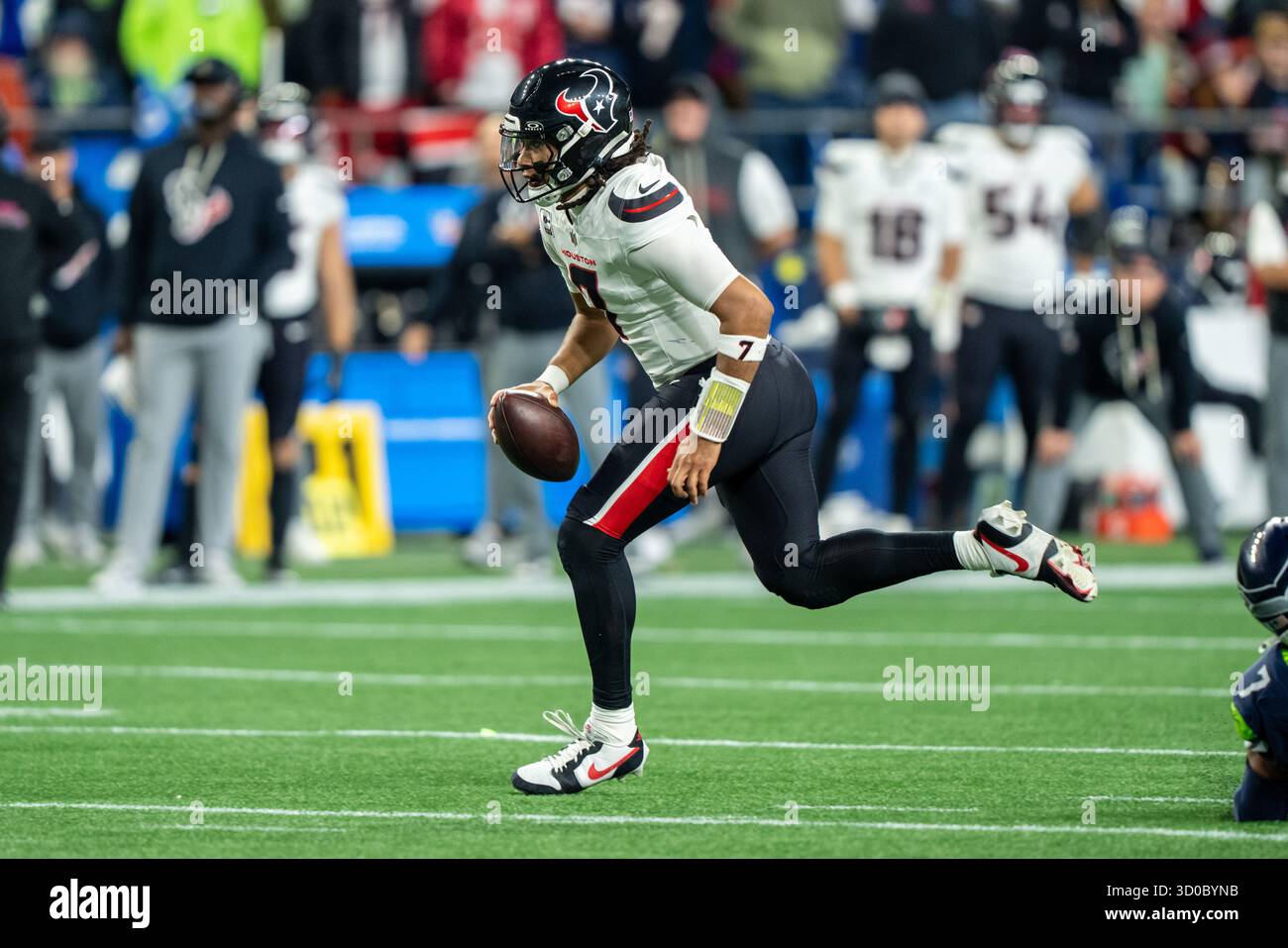 Houston Texans quarterback C.J. Stroud runs with the ball during an NFL ...
