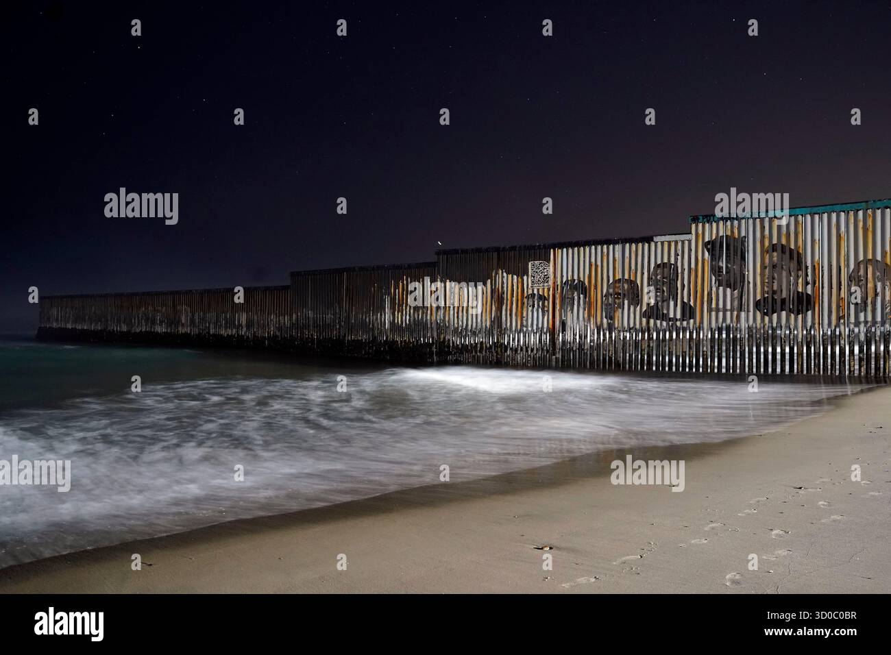 FILE - The border fence ends at the Pacific Ocean, Dec. 20, 2022, in ...