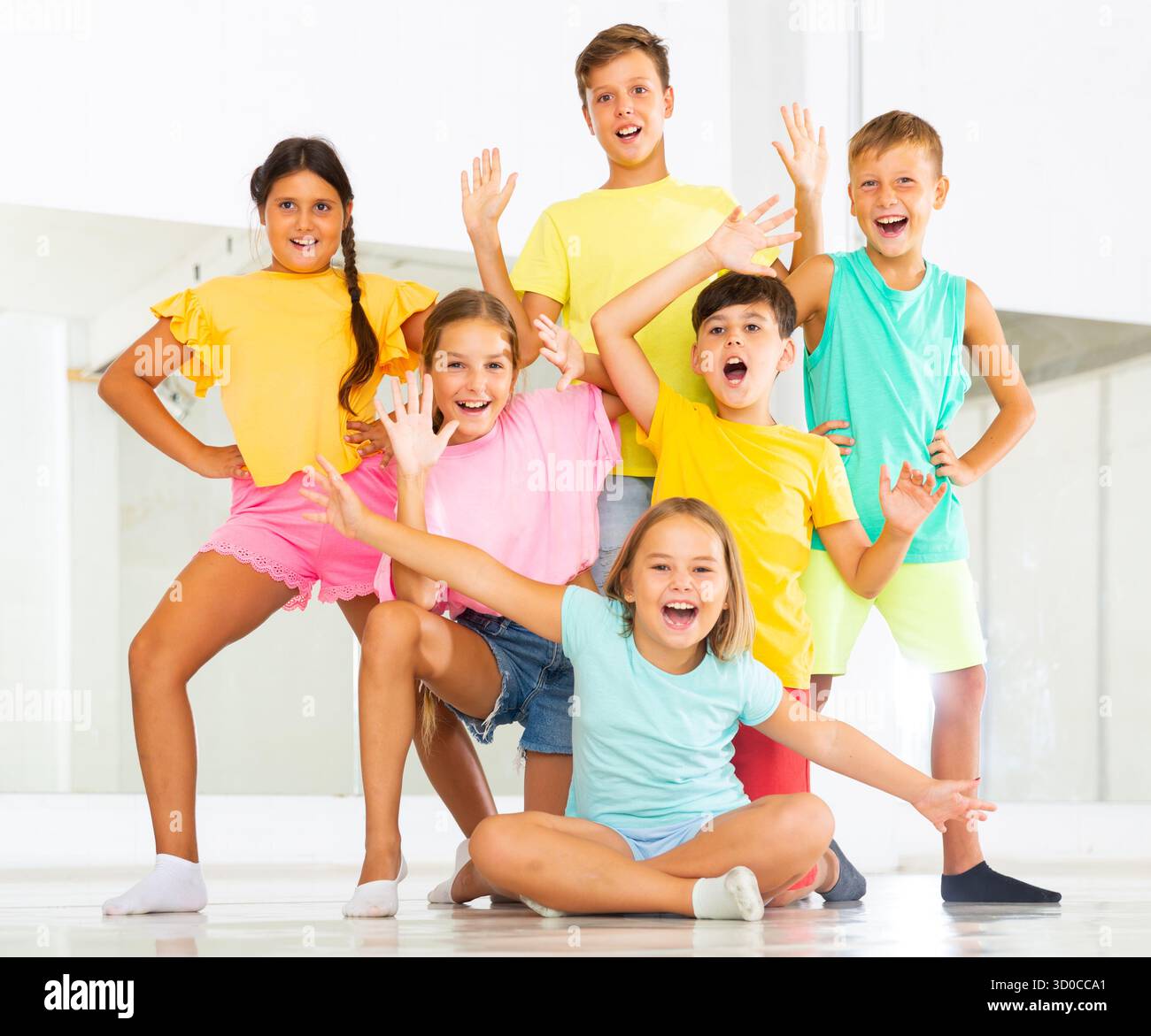 Group of happy cheerful tweenagers posing in dance studio Stock Photo ...