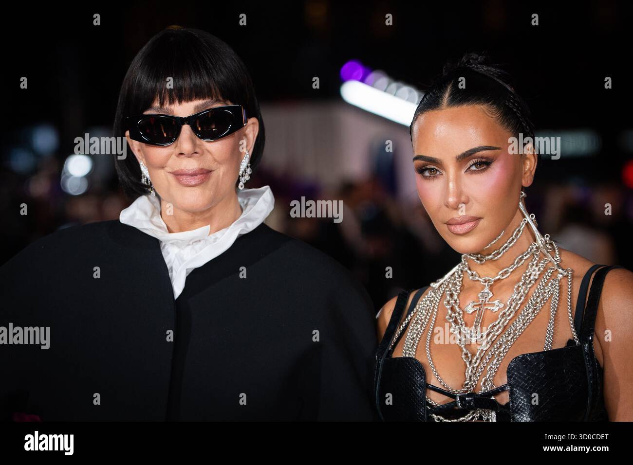 Kris Jenner, left, and Kim Kardashian pose for photographers upon ...