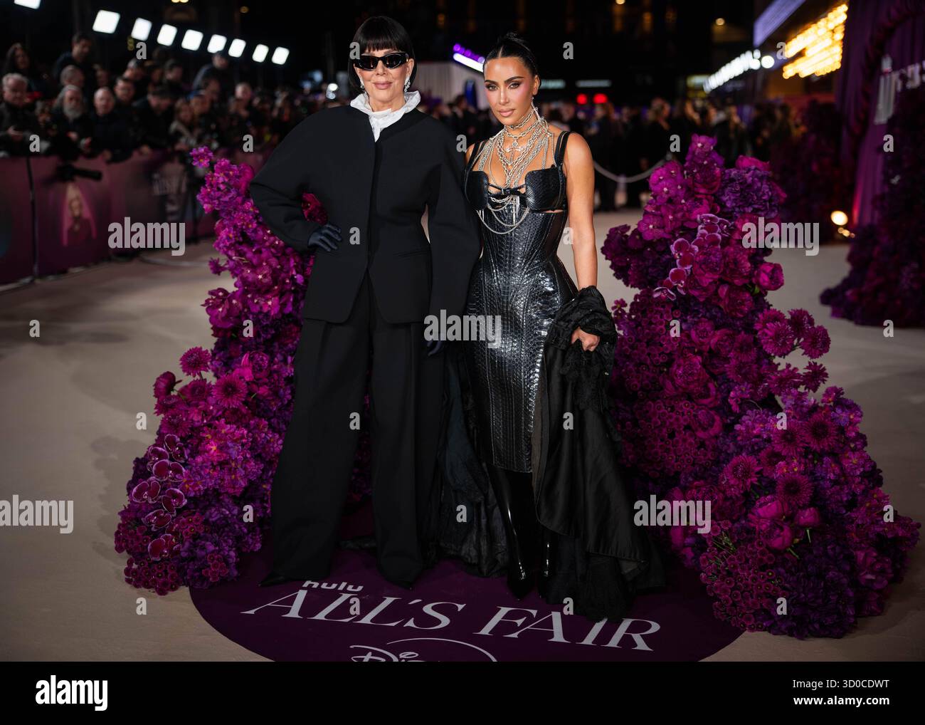 Kris Jenner, left, and Kim Kardashian pose for photographers upon ...