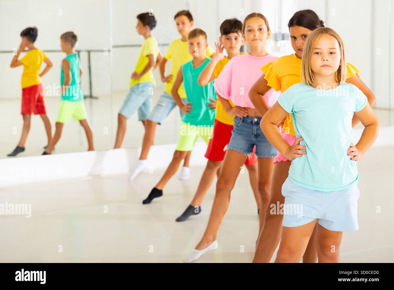 Group of kids standing in row in studio Stock Photo - Alamy
