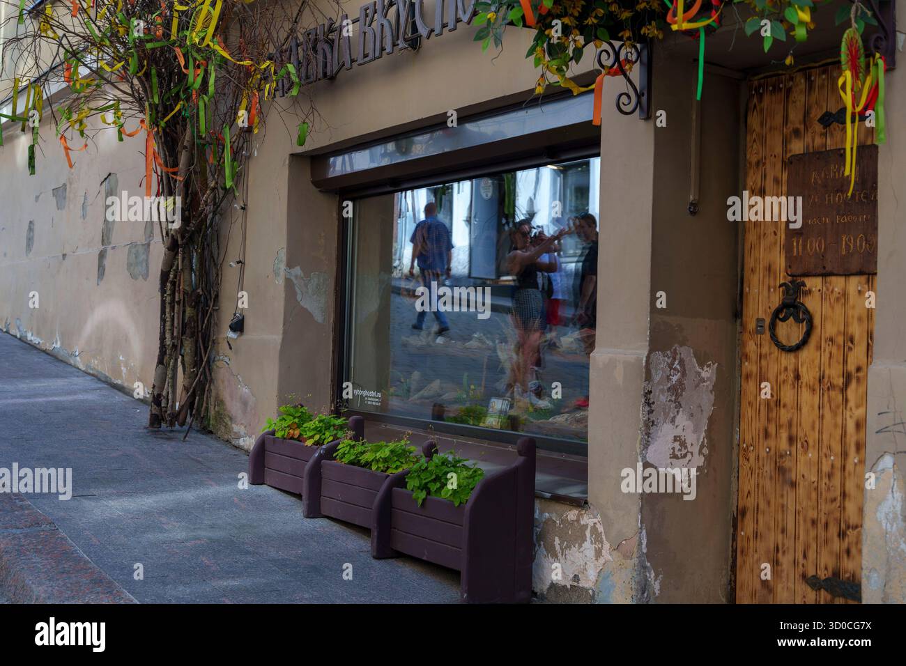 Charming bakery or café with a large display window showing baked goods ...