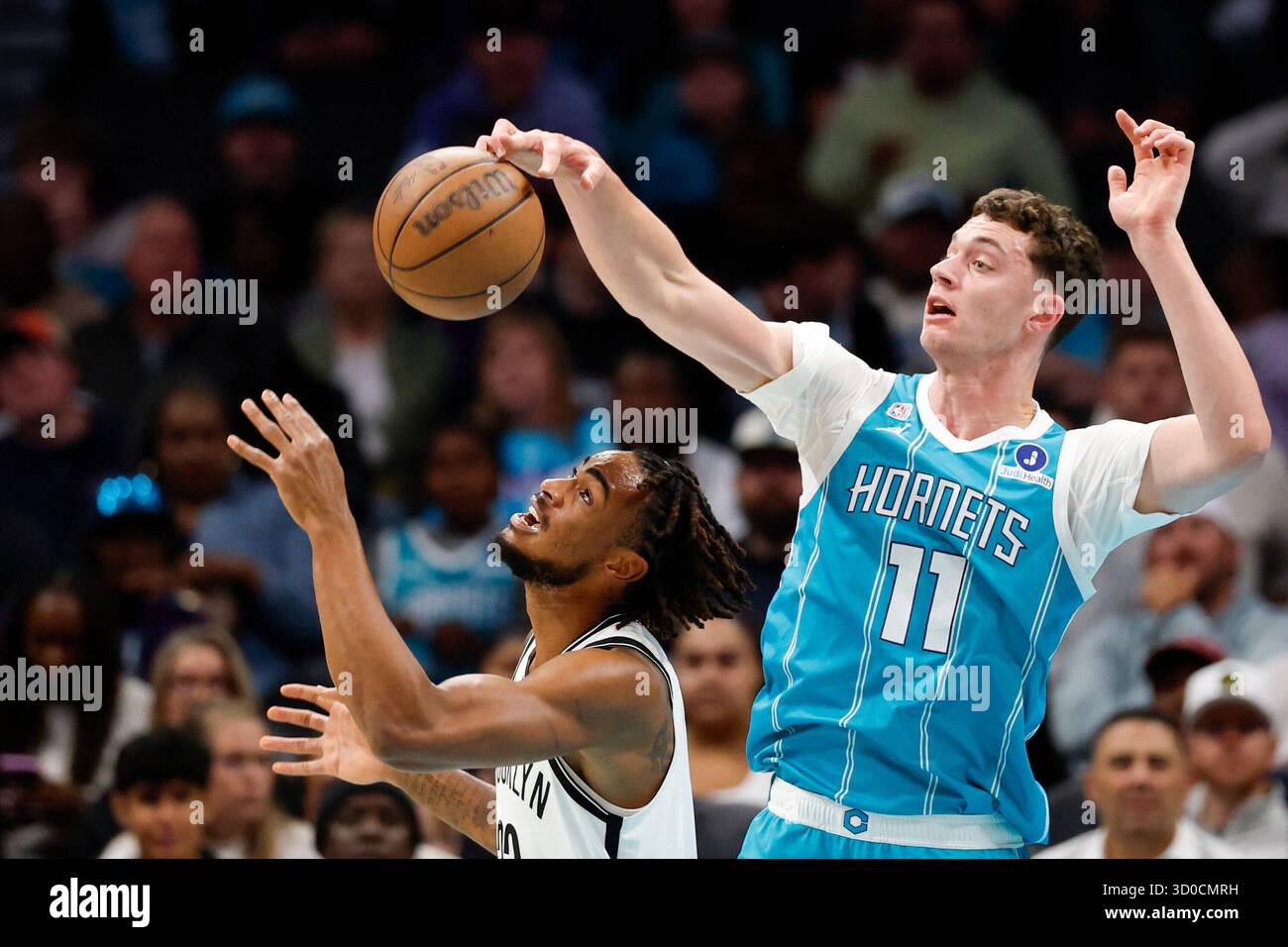 Charlotte Hornets center Ryan Kalkbrenner (11) blocks the shot of ...