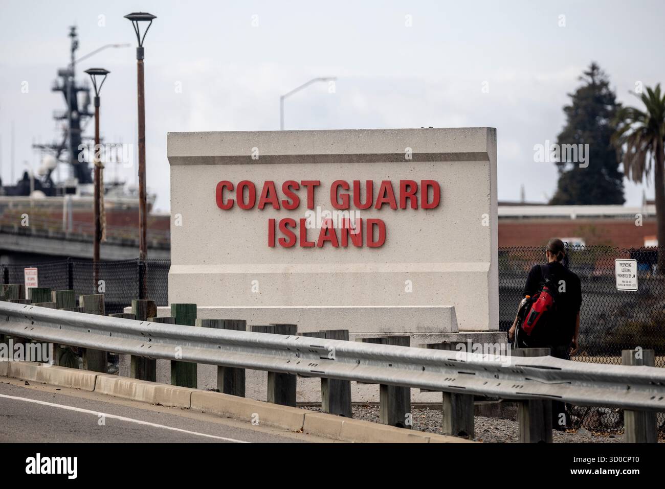 A sign stands by the bridge that leads to Coast Guard Island Alameda in ...