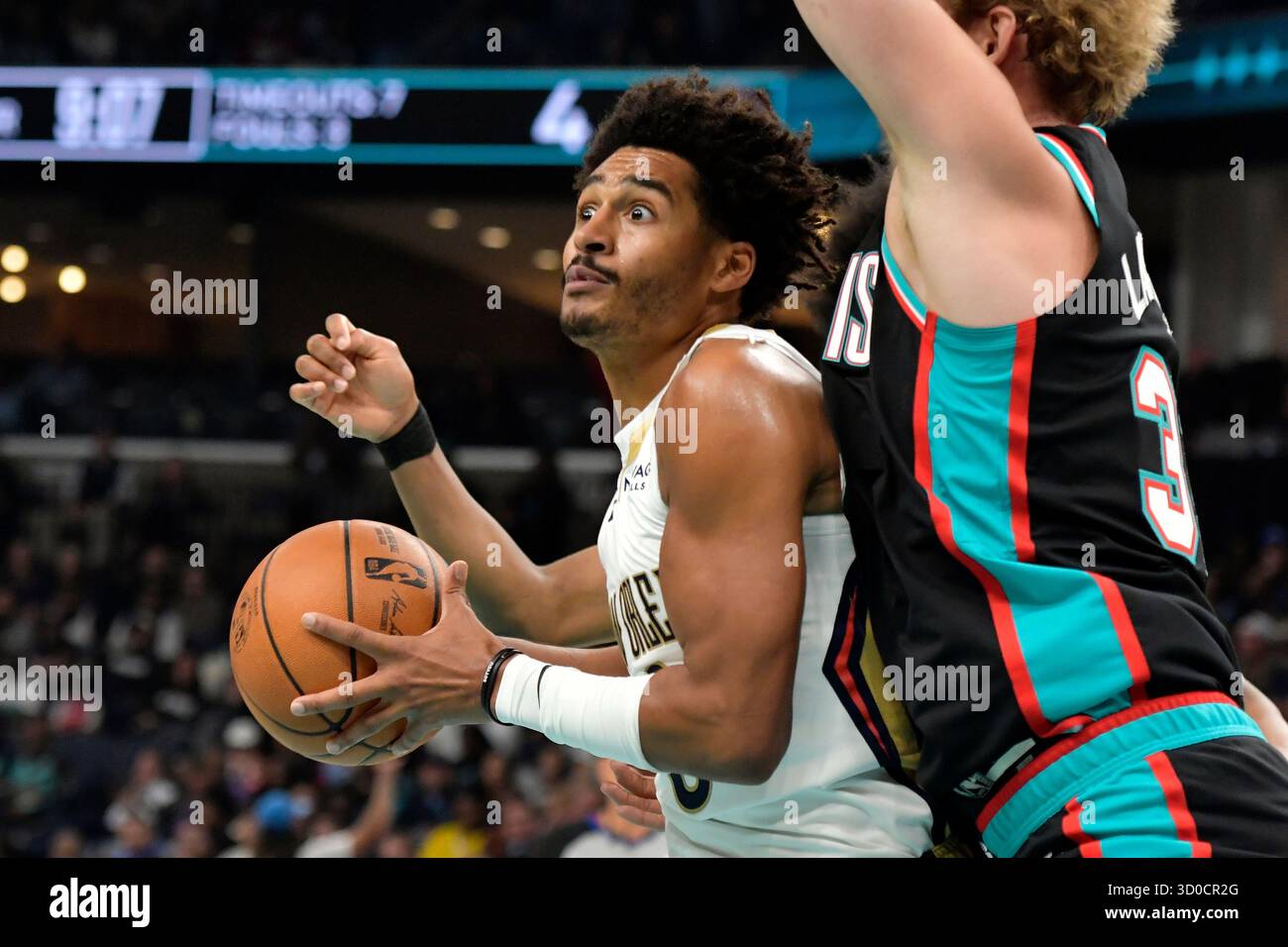 New Orleans Pelicans guard Jordan Poole, left, handles the ball against ...