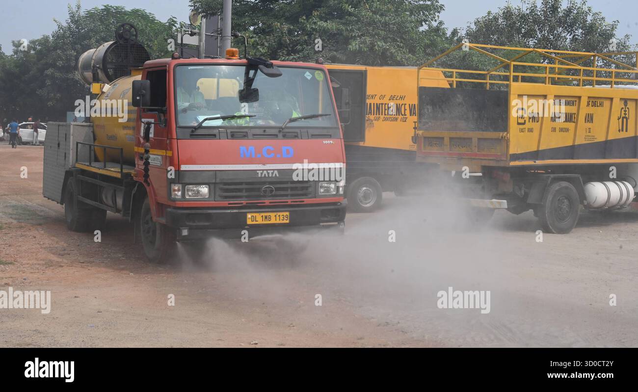 NEW DELHI, INDIA - OCTOBER 22: MCD department worker Water spraying for ...