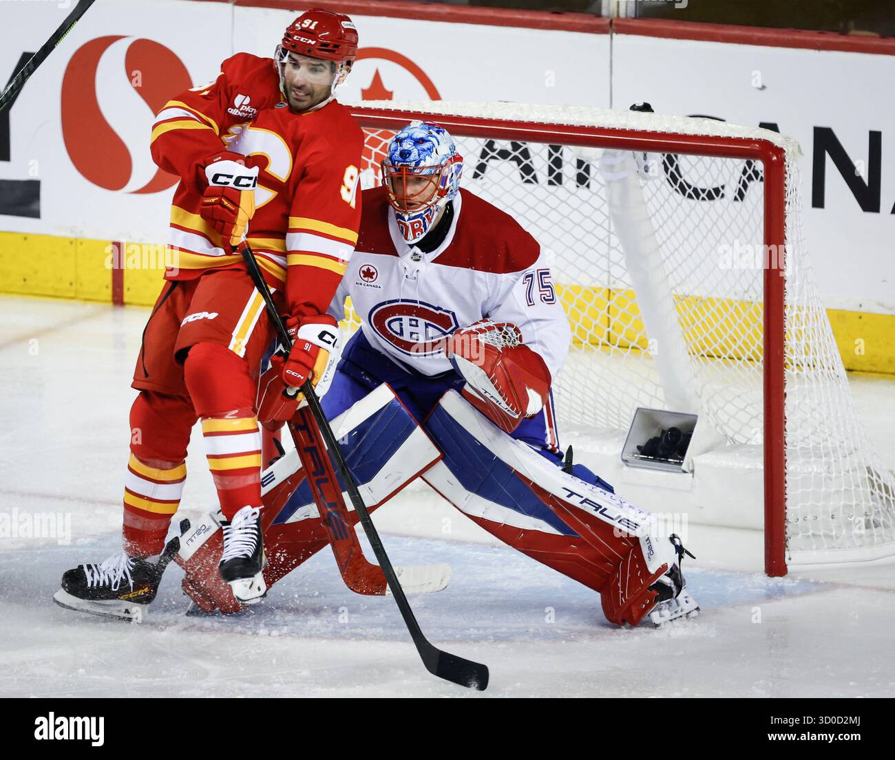 Montreal Canadiens goalie Jakub Dobes, right, holds his ground as ...