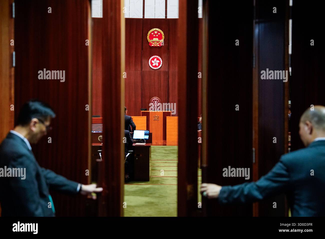 Workers closing the doors of the chambers of the legislative council on ...