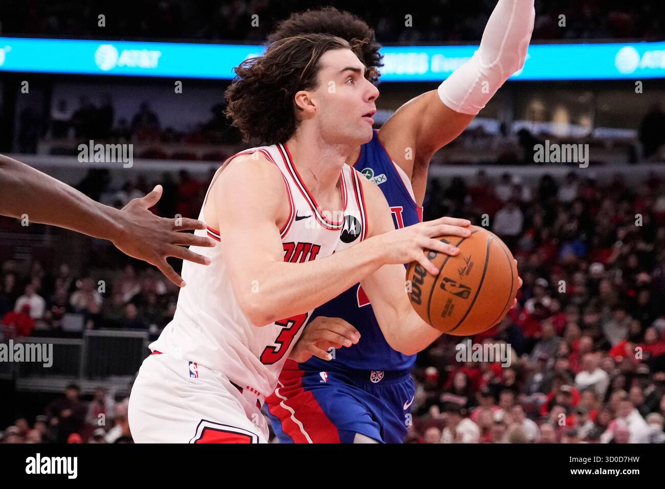 Chicago Bulls guard Josh Giddey, left, drives to the basket against ...
