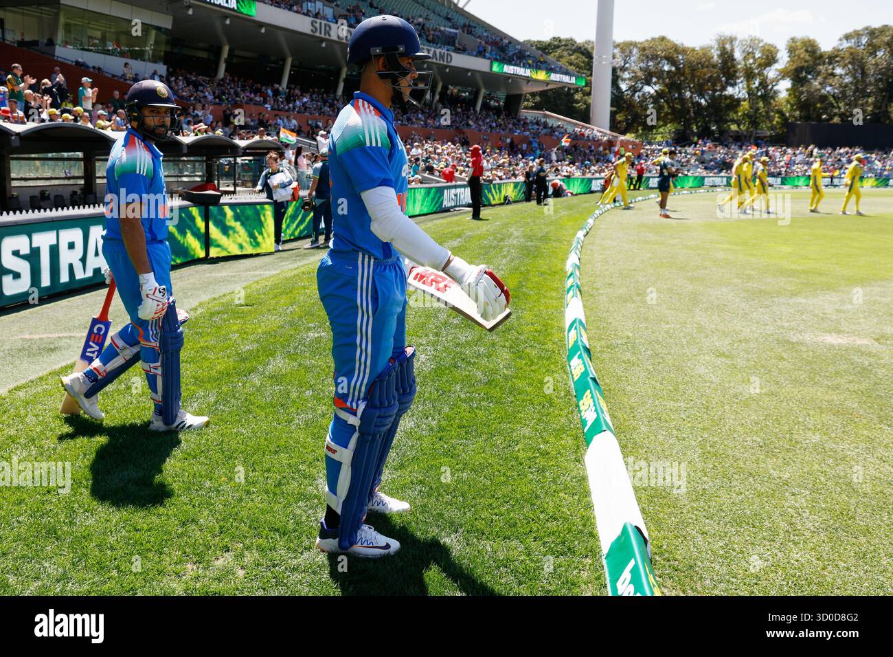 India's Shubman Gill, right, and Rohit Sharma prepare to walk onto the ...