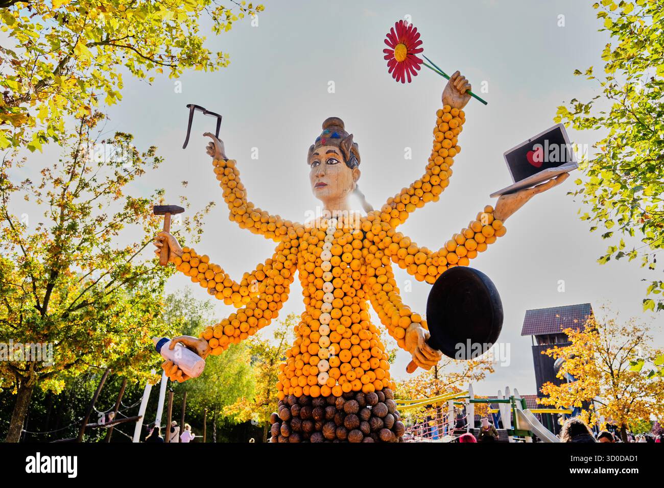A pumpkin sculpture depicting a goddess with six arms, is displayed at ...
