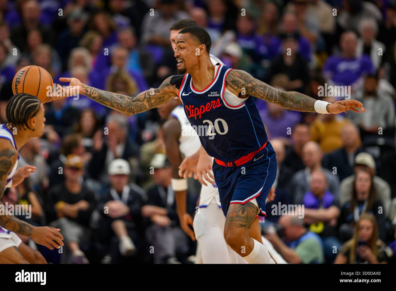 LA Clippers forward John Collins (20) tips the basketball away from ...