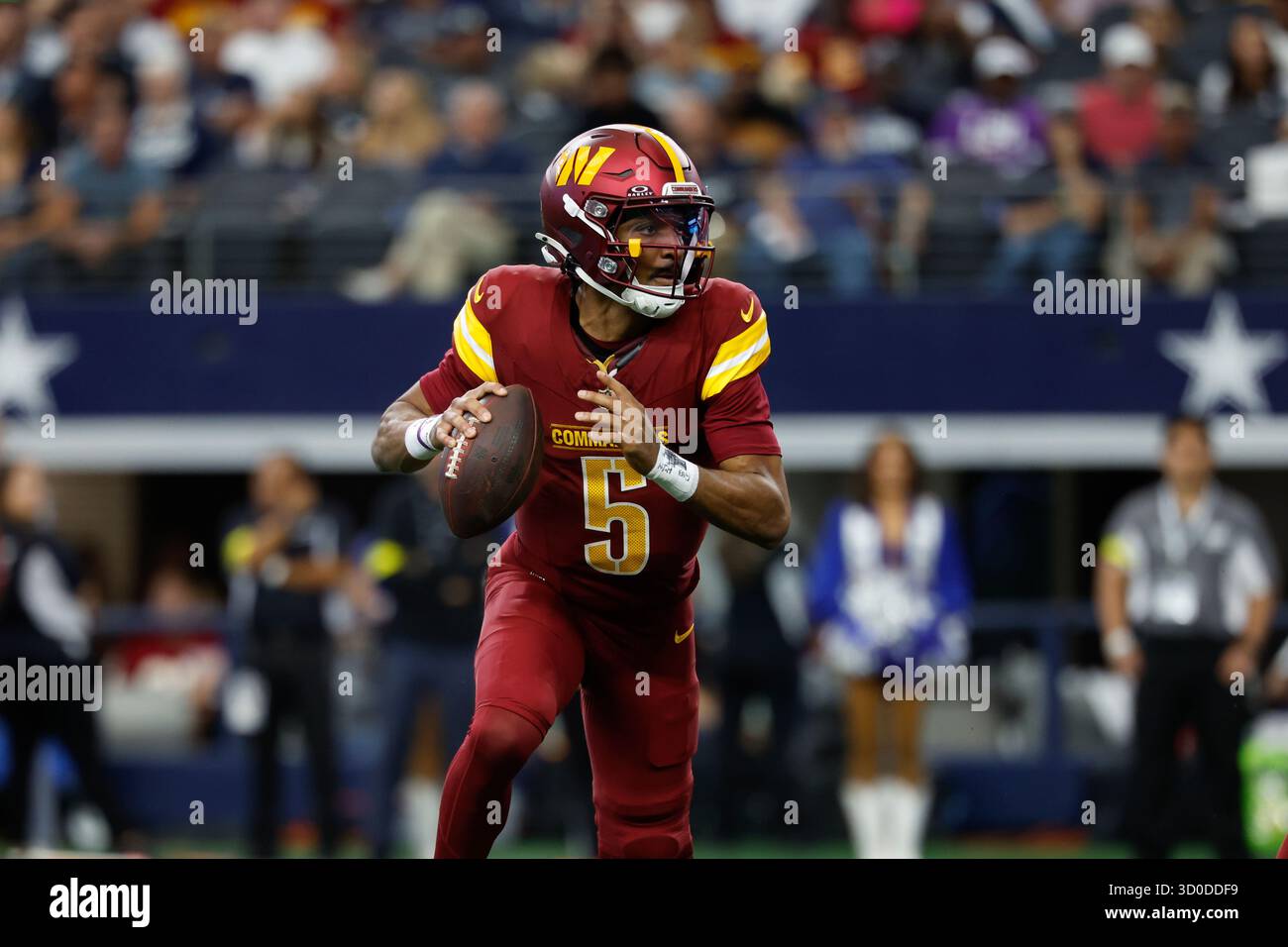 Washington Commanders quarterback Jayden Daniels (5) looks to pass as ...