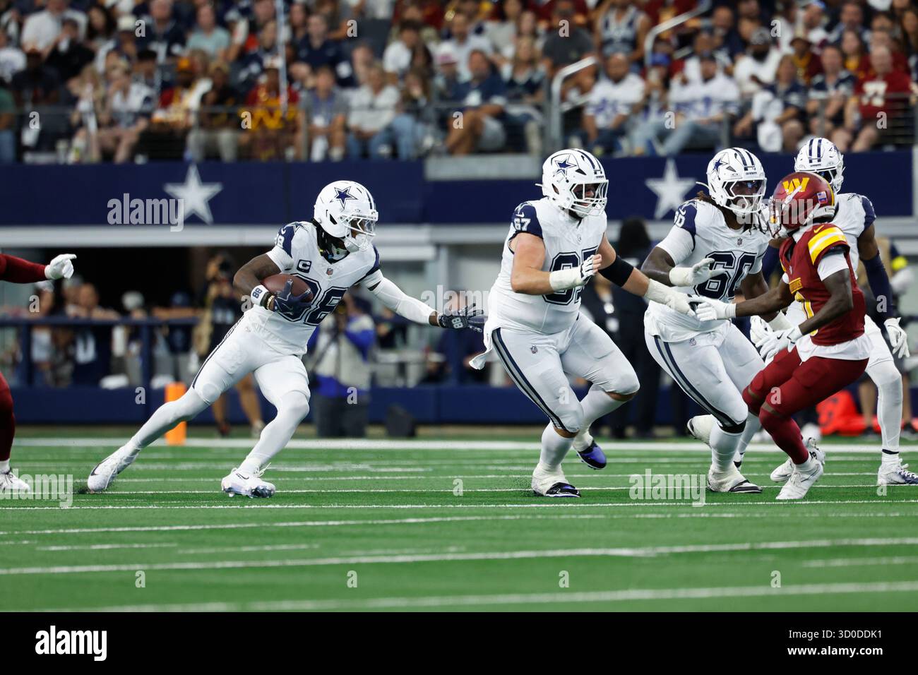 Dallas Cowboys wide receiver CeeDee Lamb (88) follows blockers after a ...