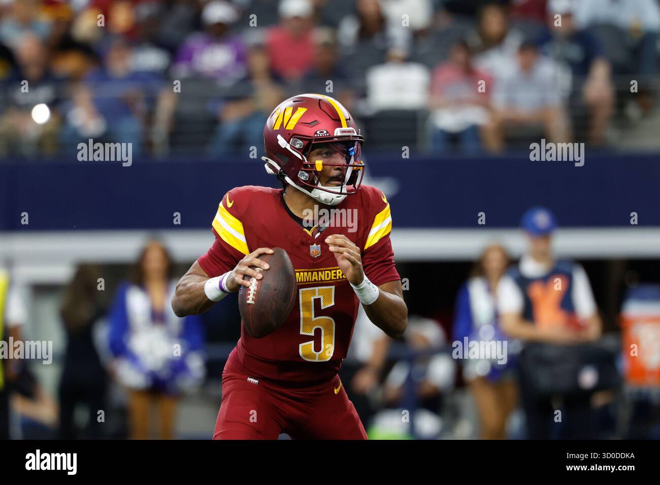 Washington Commanders quarterback Jayden Daniels (5) looks to pass ...