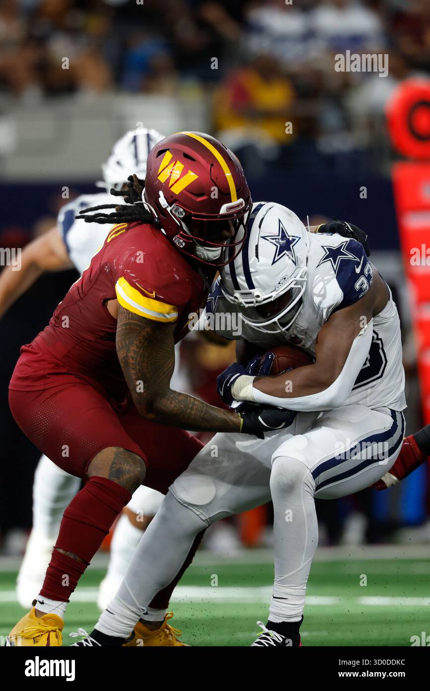 Washington Commanders linebacker Frankie Luvu (4) makes the tackle on ...
