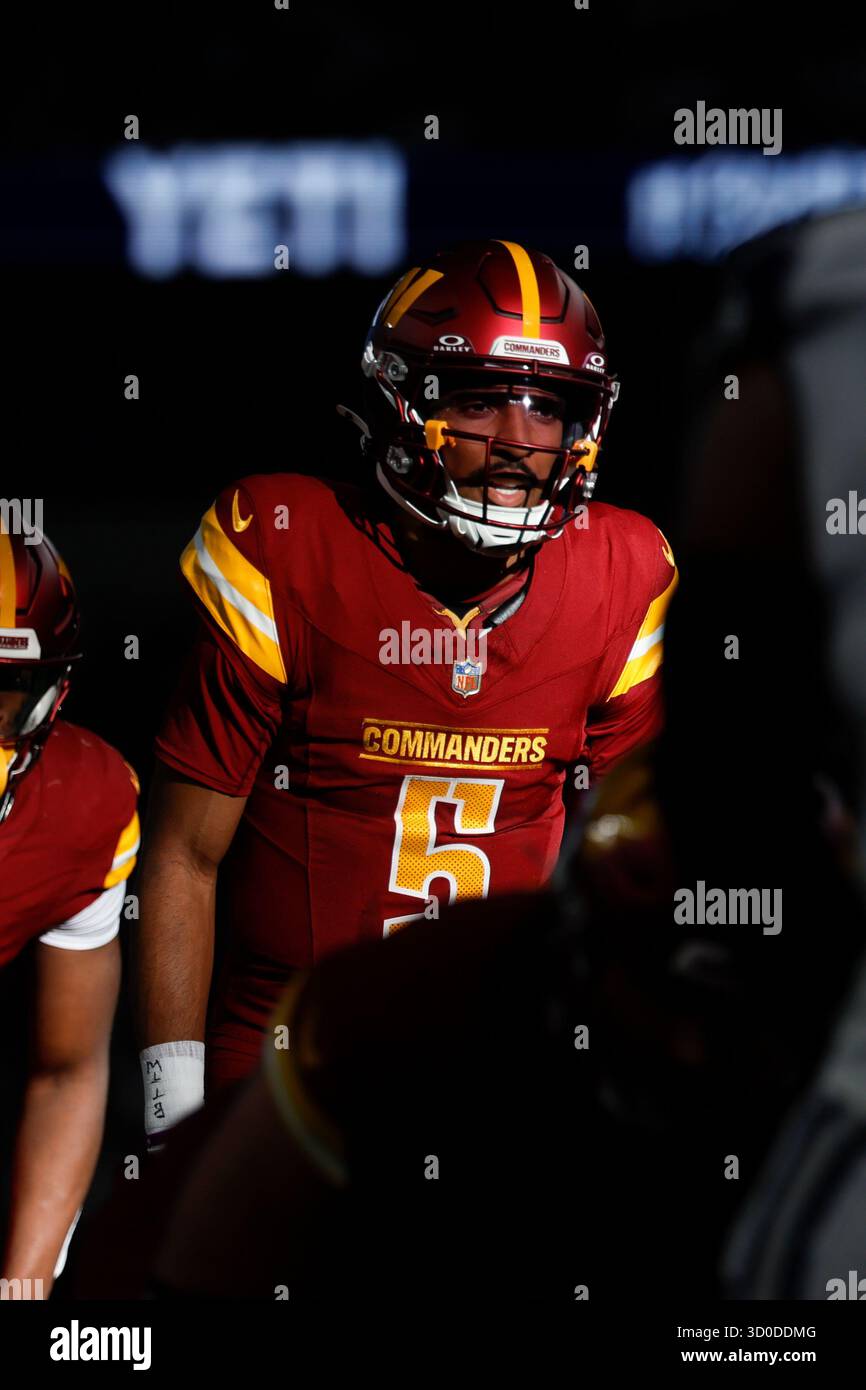 Washington Commanders quarterback Jayden Daniels (5) lines up for the ...