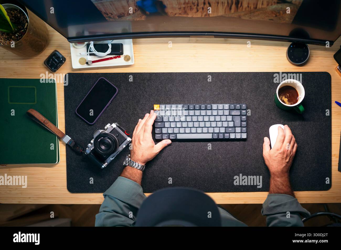 Overhead view of man working at tidy desk Stock Photo - Alamy