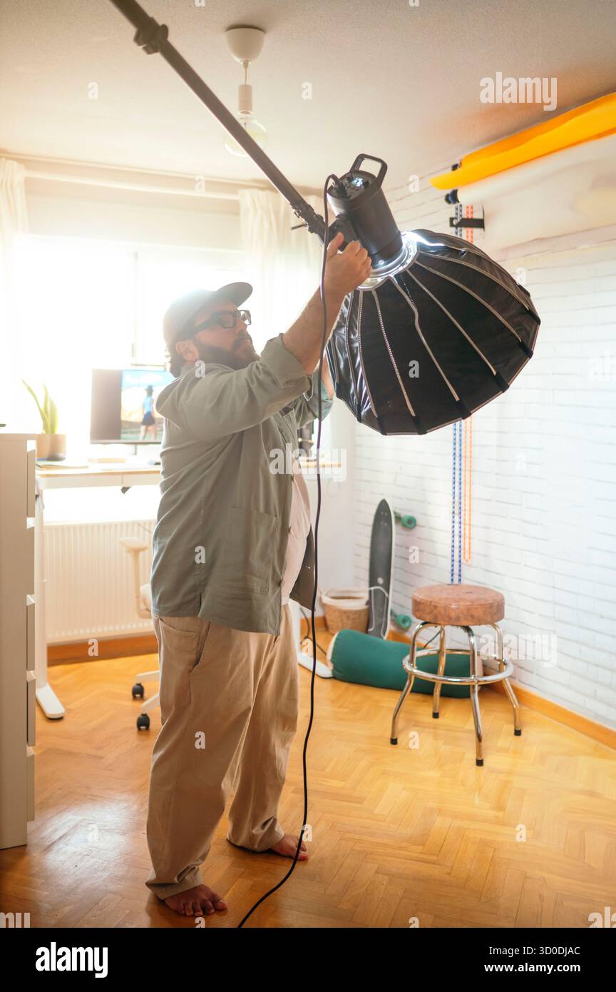 Man adjusting setup in hi-res stock photography and images - Alamy