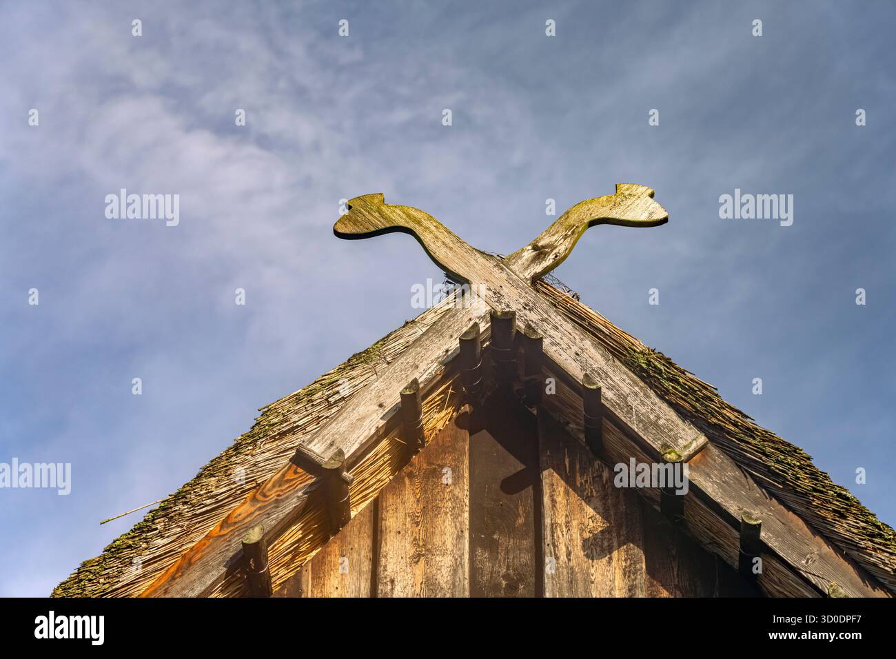 Typical traditional gable with the symbol of two crossed snakes in the ...