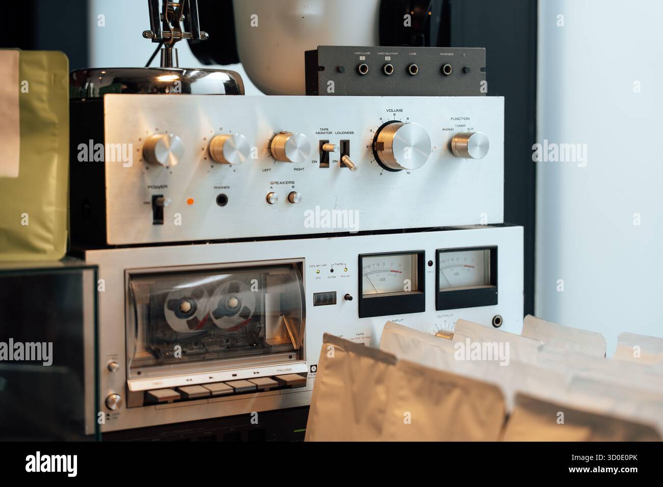 Vintage audio equipment with recording tapes and various controls on ...